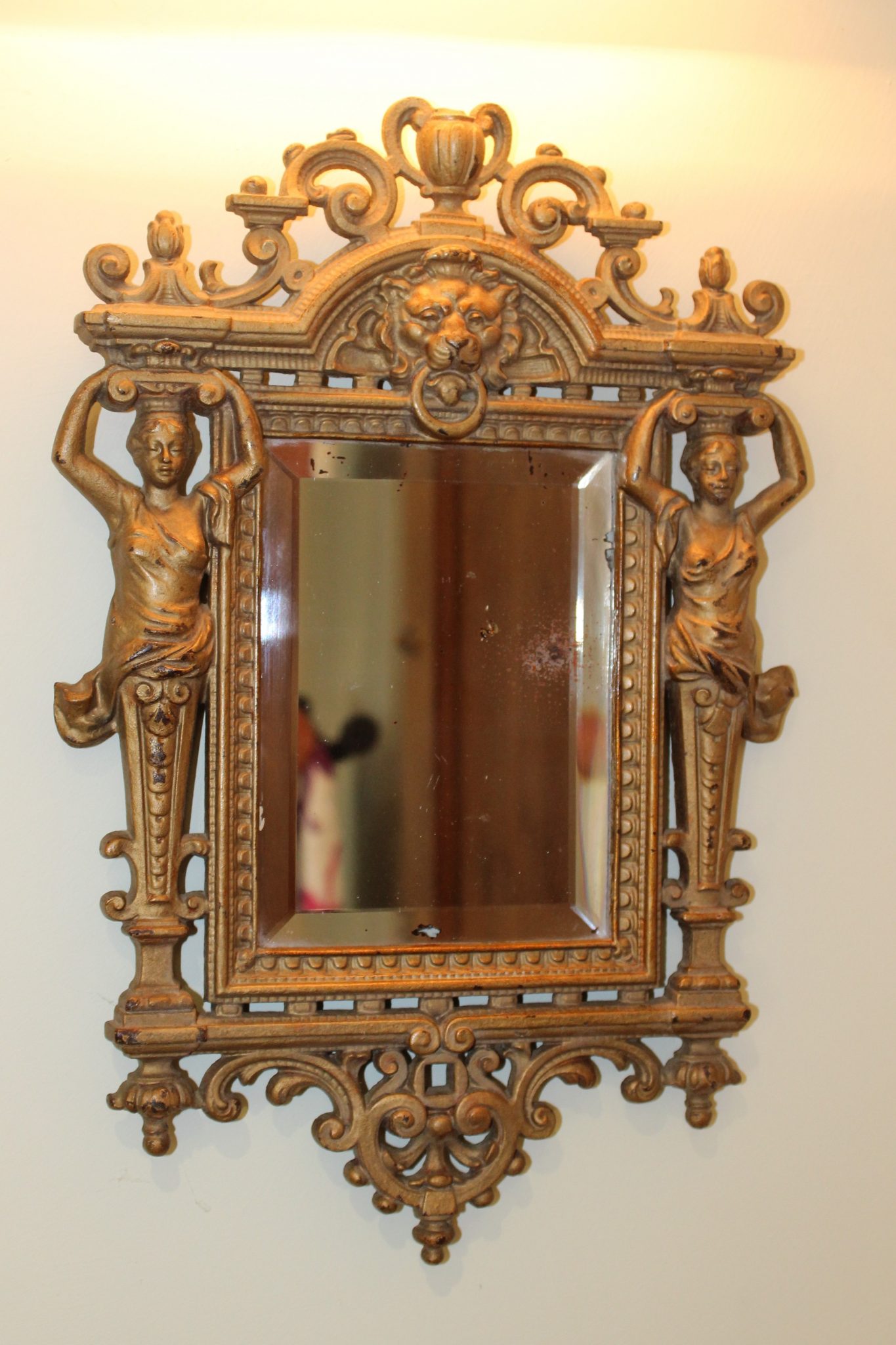 A rather interesting small late Victorian cast Iron, gilt mirror ...